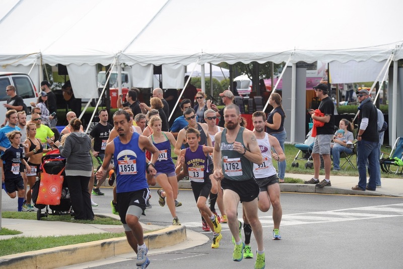 Some 2,000 runners stride the streets of Milton in the Dogfish Dash 8K ...