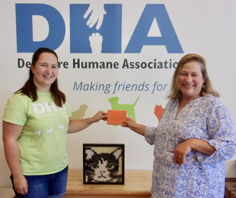 Supporter presents check to Delaware Humane Association | Cape Gazette