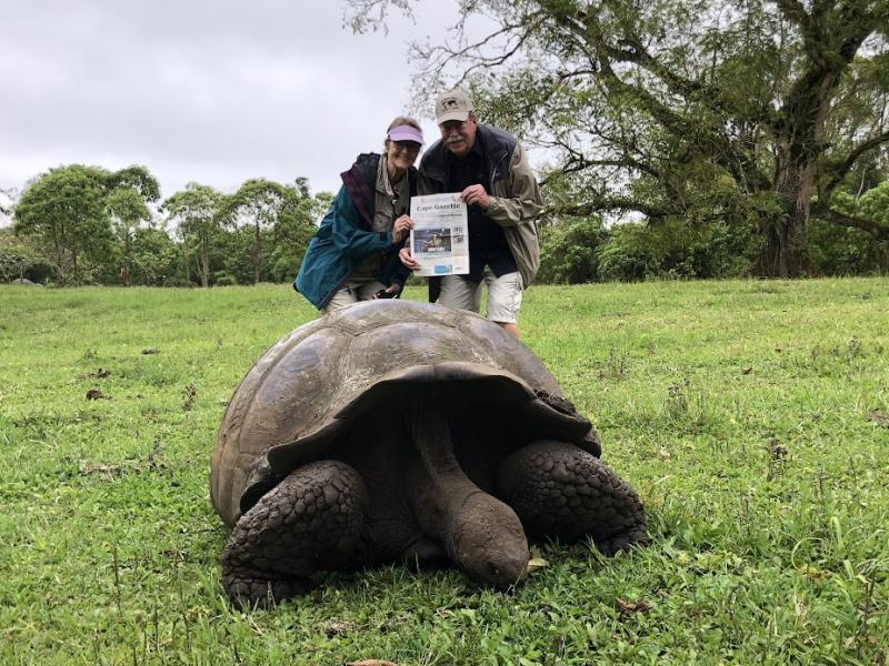 Reading the Gazette with the giant tortoises at the El Chato Ranch on ...